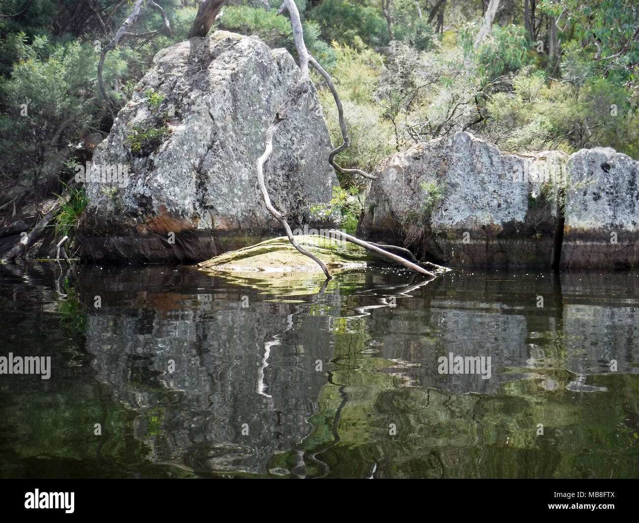 Reflection of rocks on water at Dunns Swamp NSW Australia Stock Photo ...