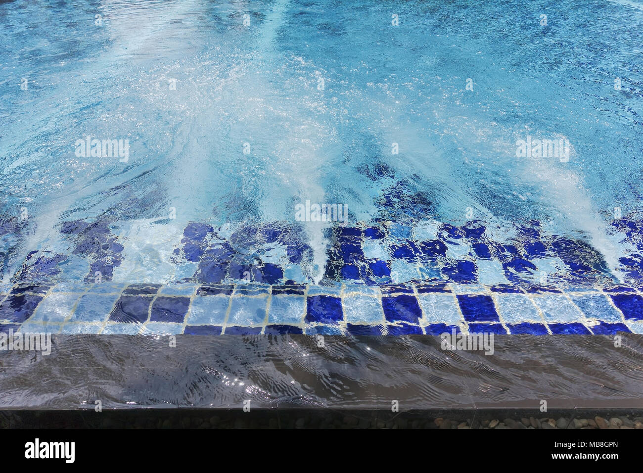 Inflowing water jet into a pool Stock Photo - Alamy