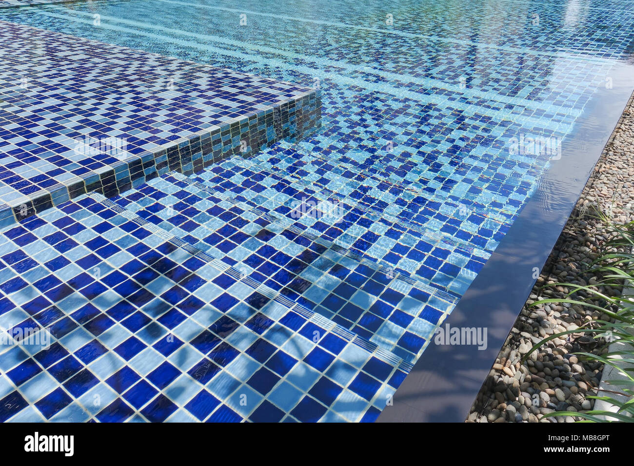 Outdoor swimming pool with random pattern of mosaic Stock Photo - Alamy