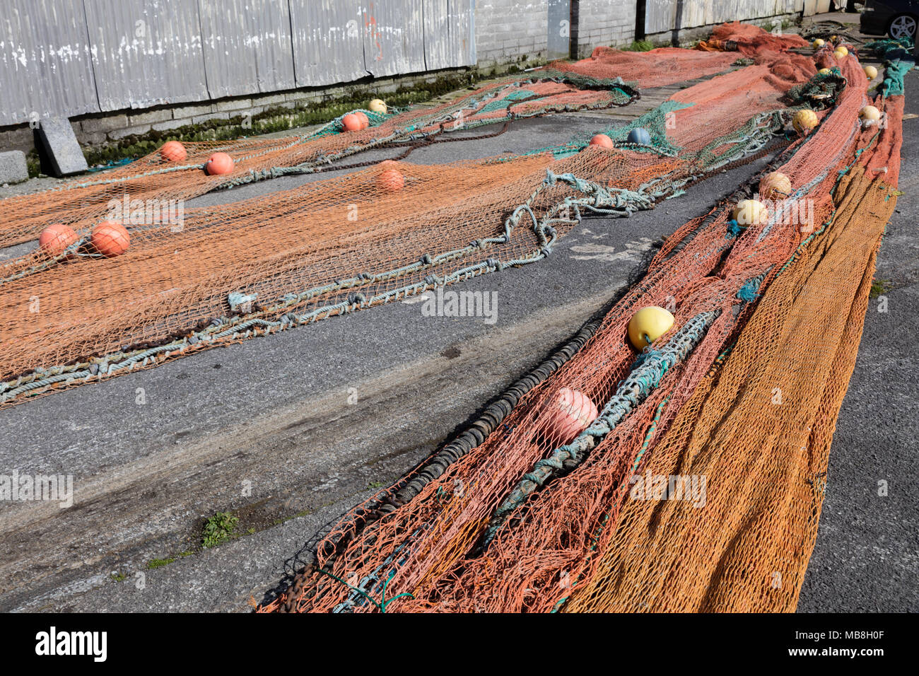 fishing net laid out on a pier Stock Photo - Alamy