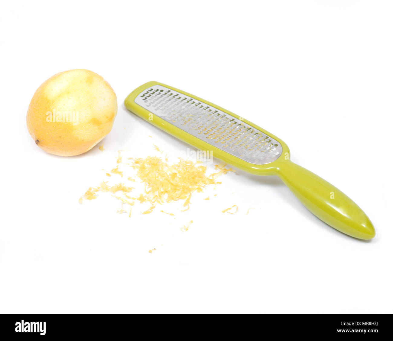 Stainless steel grate zester and lemon peel, zest isolated on white ...