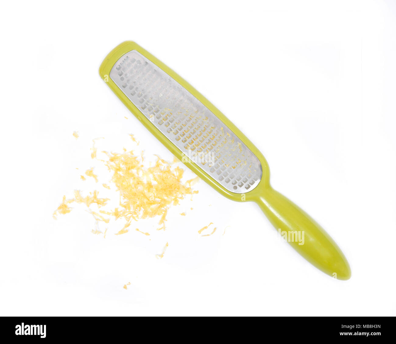 Stainless steel grate zester and lemon peel, zest isolated on white ...