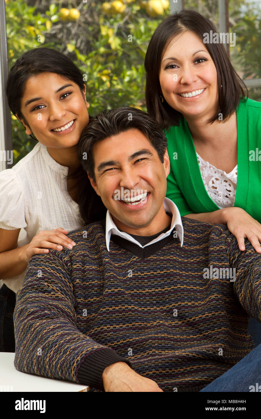 Hispanic family with a teen daughter Stock Photo - Alamy