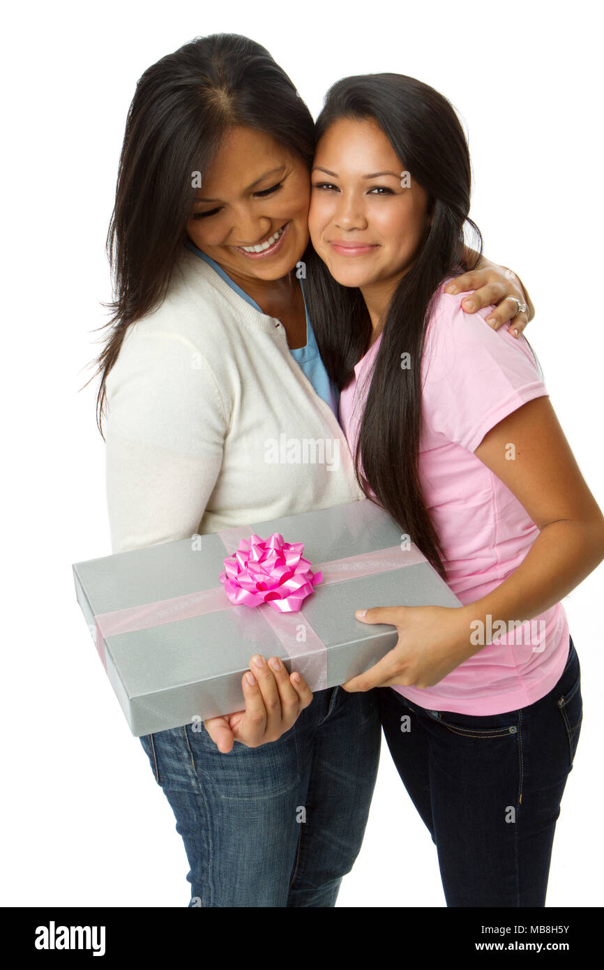 Daughter giving a gift to her mom Stock Photo - Alamy