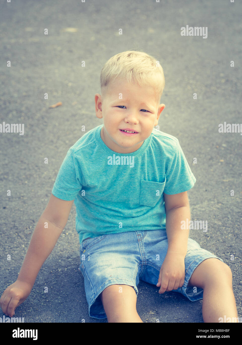 Cute doing exercises . Child outdoor activity Stock Photo - Alamy