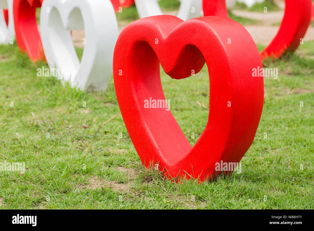 Big heart made from cement for decorative garden Stock Photo - Alamy