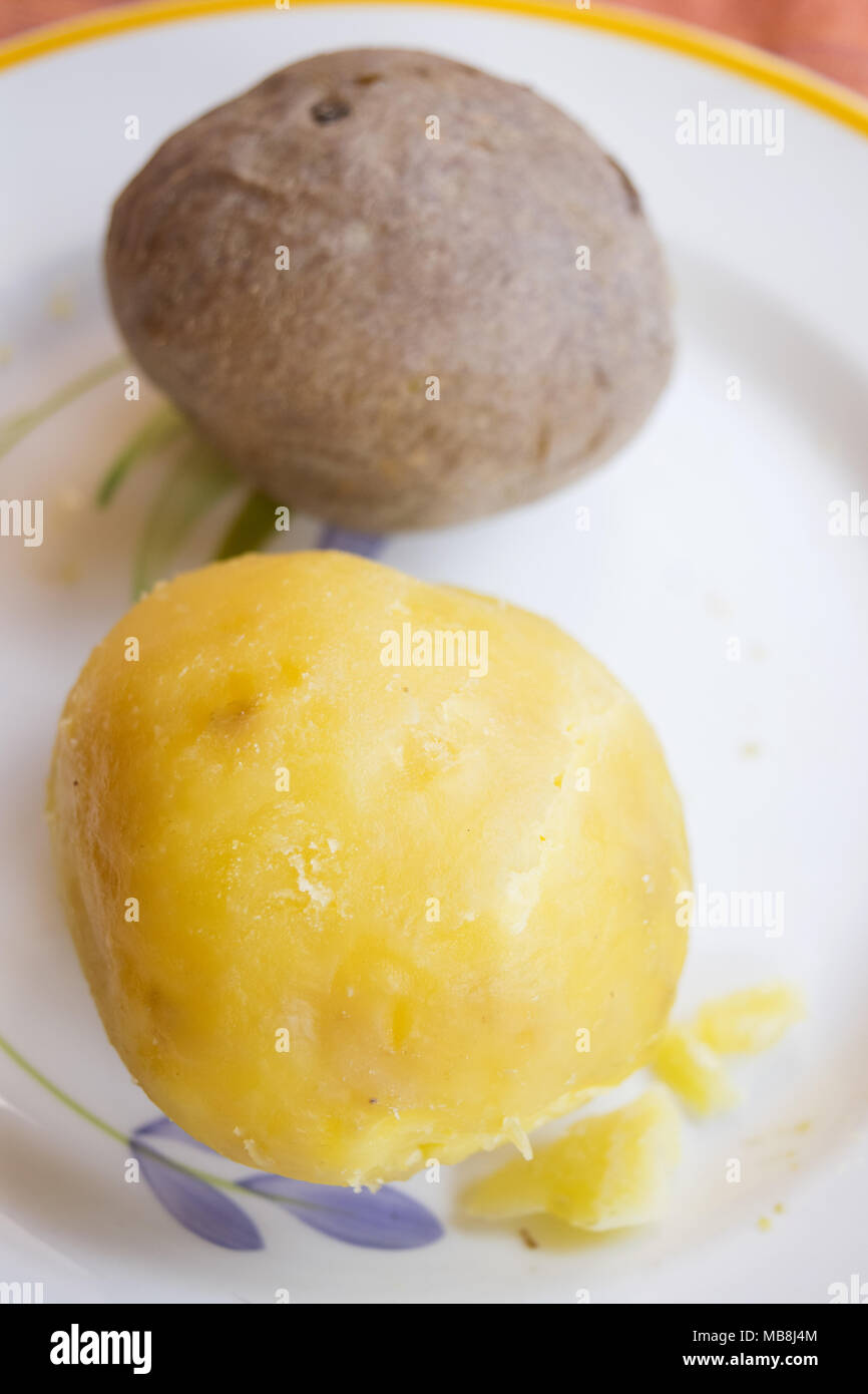 boiled potato whithout peel approached to one with the peel Stock Photo ...