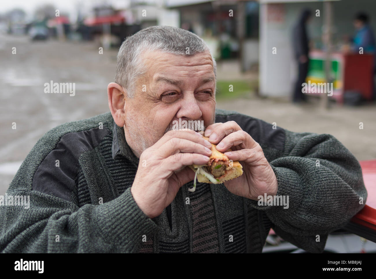 Fat man eating kebab hi-res stock photography and images - Alamy