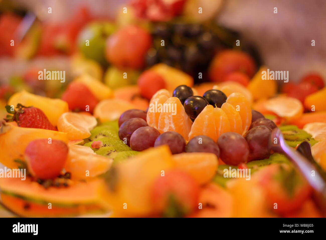 Colorful fruit platter with a large variety of exotic and season fruit ...