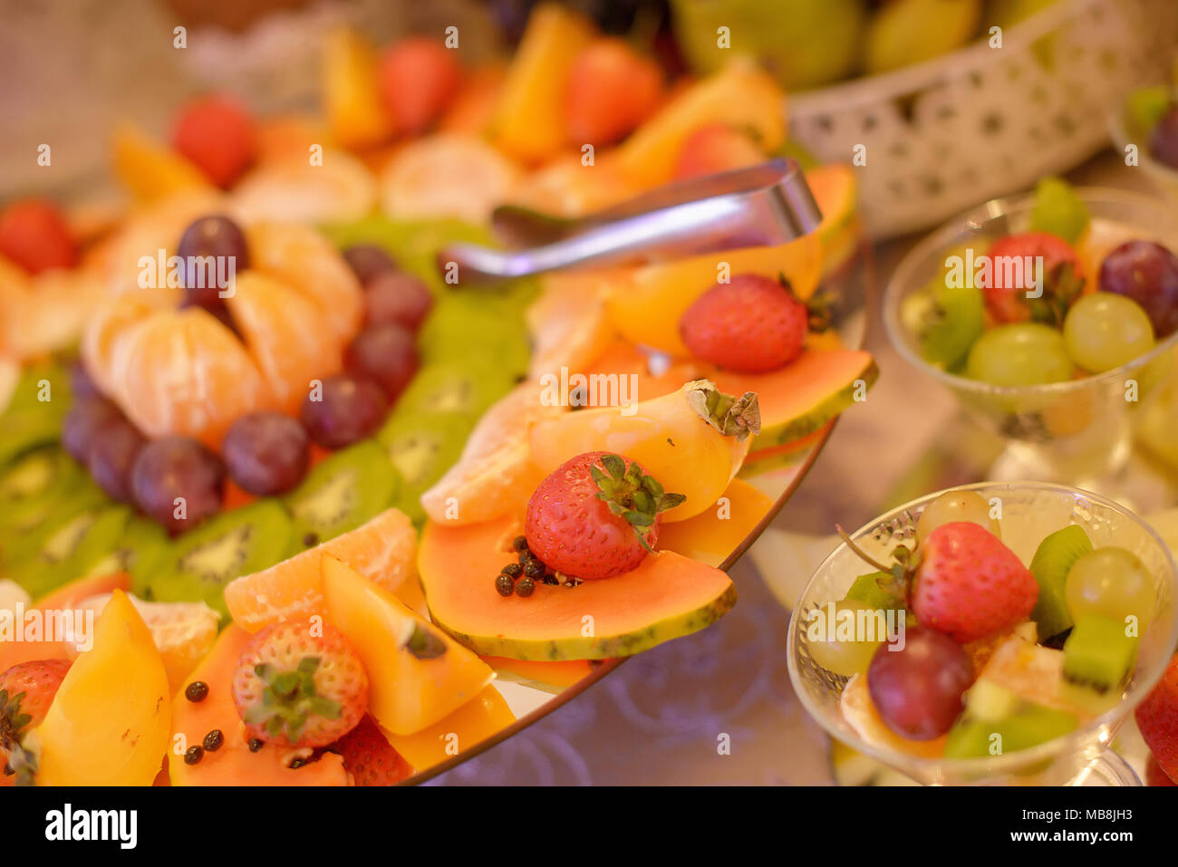Colorful fruit platter with a large variety of exotic and season fruit ...