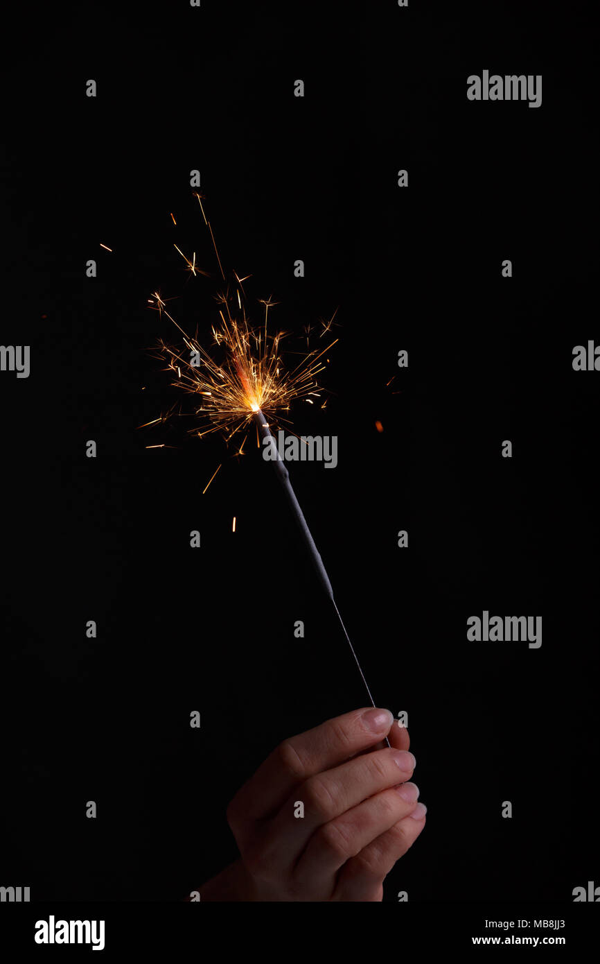 Hands holding firework light hi-res stock photography and images - Alamy
