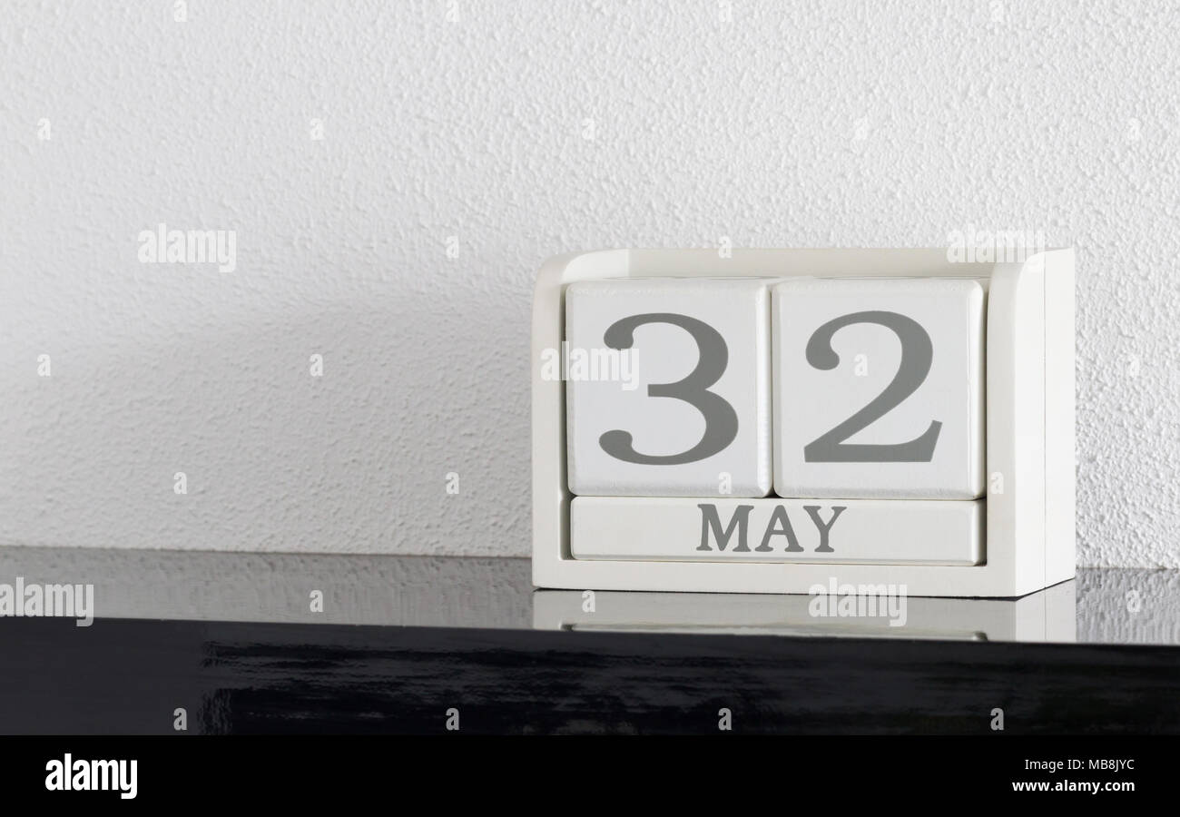White block calendar present date 32 and month May on white wall ...