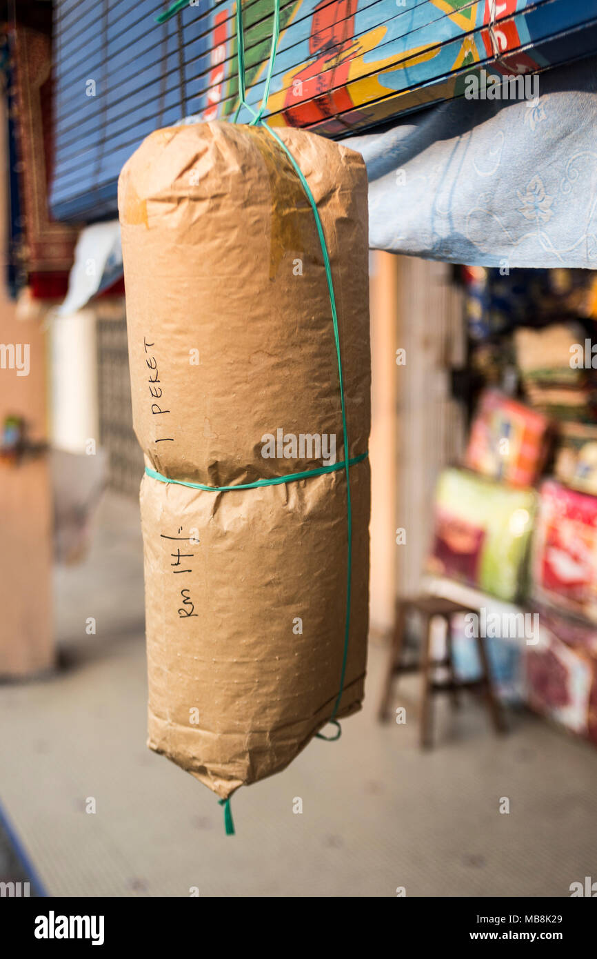 Old method of packaging wrapping with cotton content hanging outside of ...
