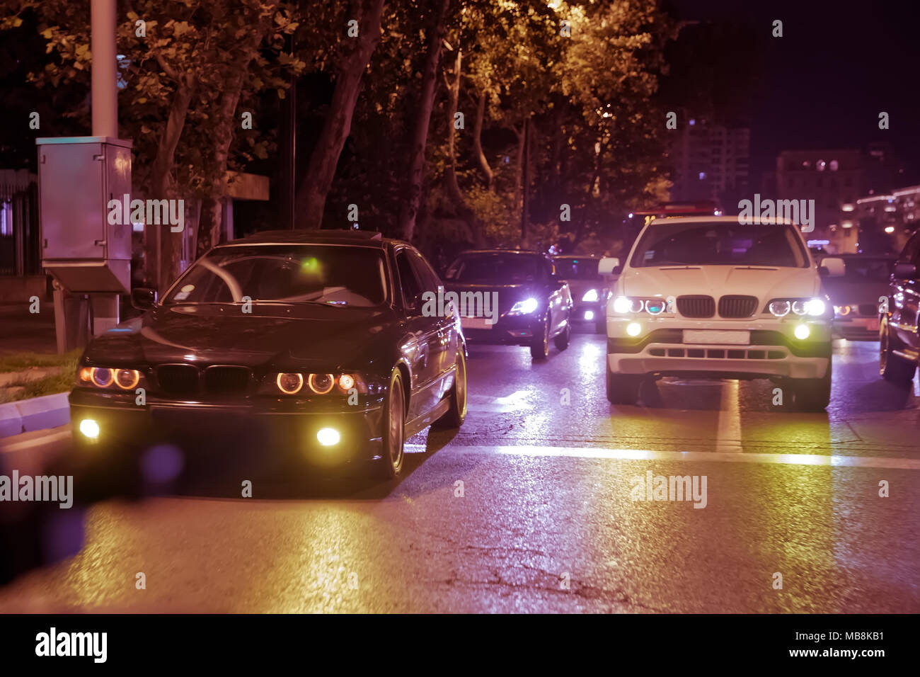 Night view of the cars. Road in the city at the night with yellow and ...
