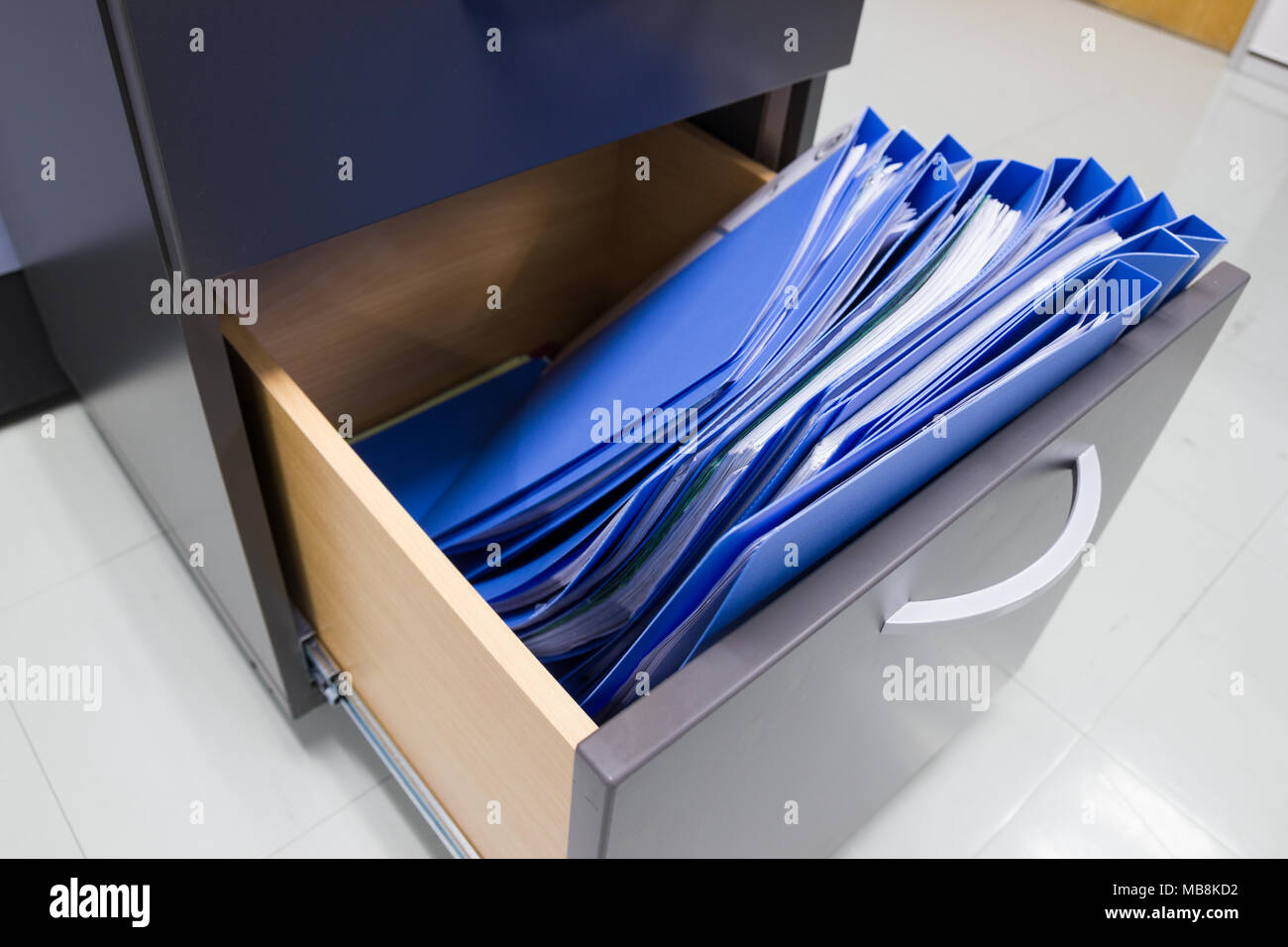 blue file folder documents In a file cabinet retention of contracts ...