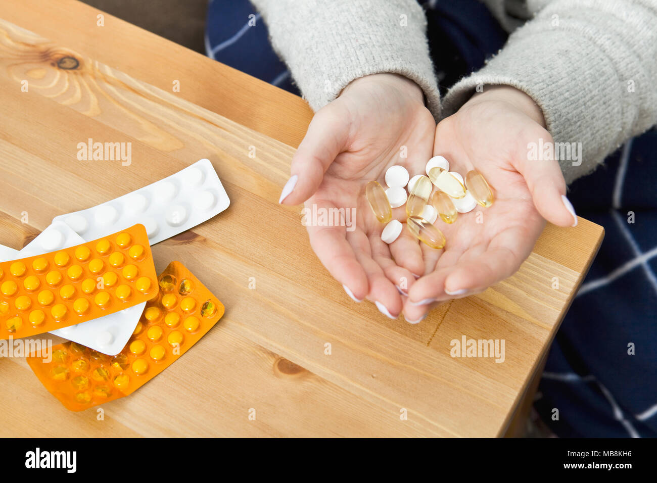 Woman taking medicine capsules at home. Drugs closeup Stock Photo - Alamy