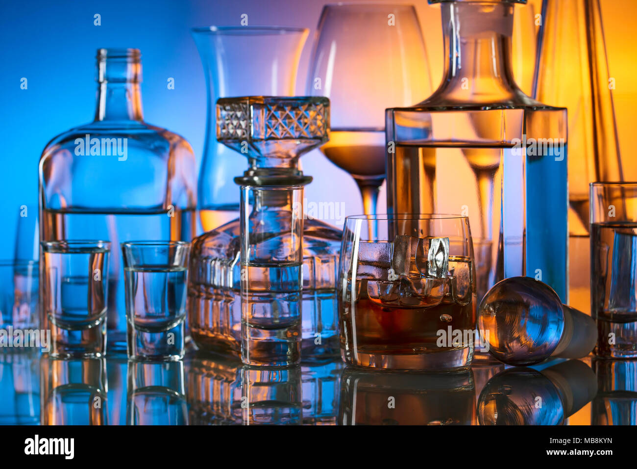 alcoholic drinks in bar on glass table Stock Photo - Alamy