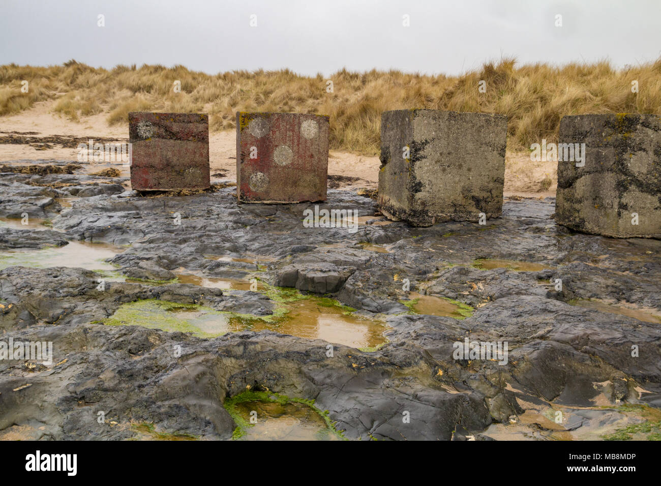 Anti tank defences at Bamburgh beach Stock Photo - Alamy