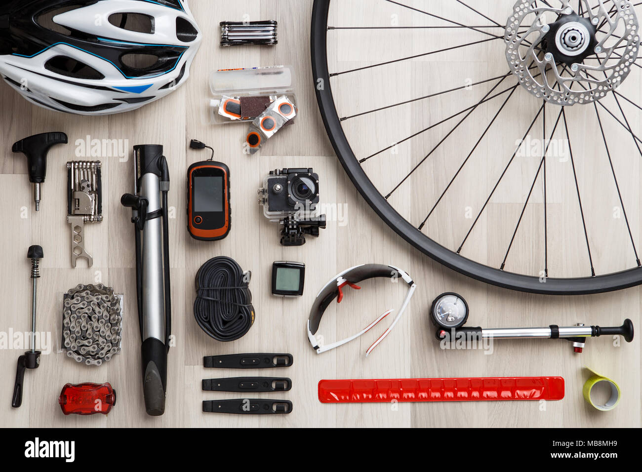 Photo of bicycle objects on wooden background. Wheel, steering wheel ...
