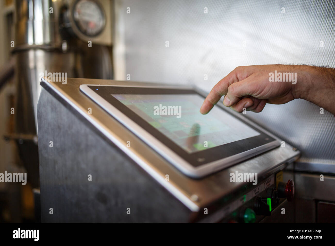 Image of computer monitor, person's hands in workshop Stock Photo - Alamy