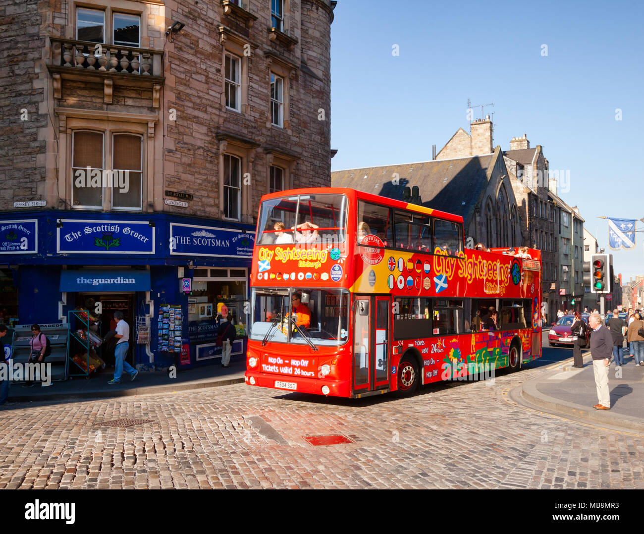 EDINBURGH, UK - AUG 8, 2012: Touristic red double-decker hop-on hop-off ...