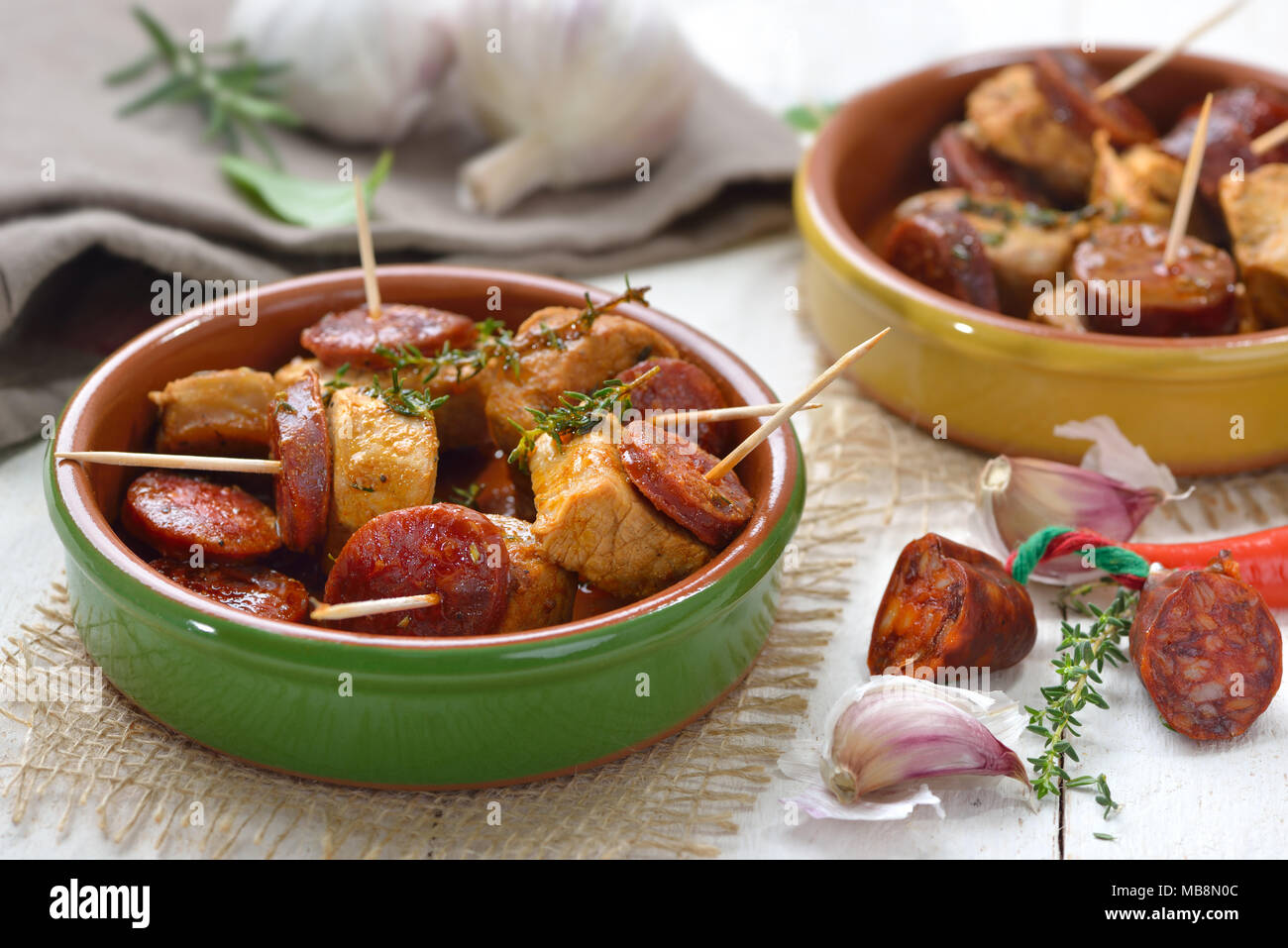 Hot Spanish snack: Braised pork fillet with fried slices of chorizo ...