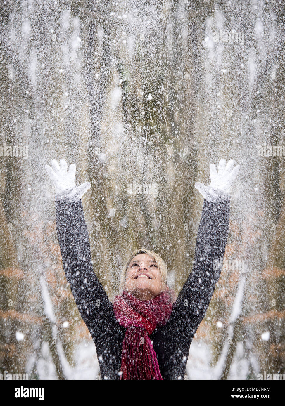 Woman throwing snow hi-res stock photography and images - Alamy