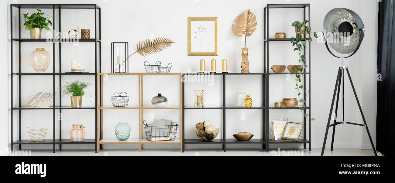 White living room interior with black, oversize lamp standing next to ...
