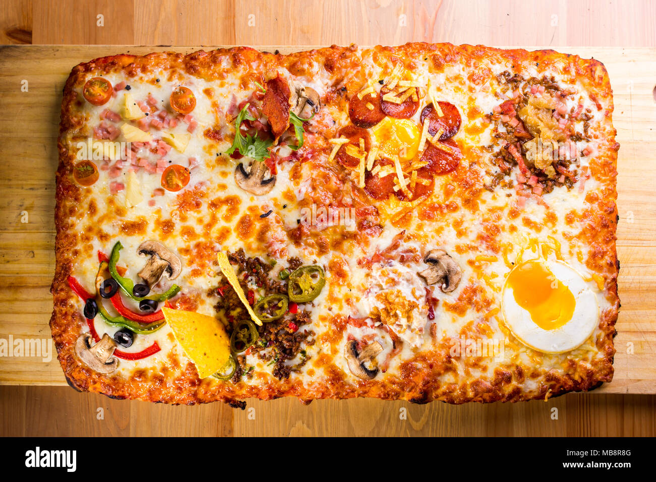 square pizza with many different ingredients Stock Photo - Alamy