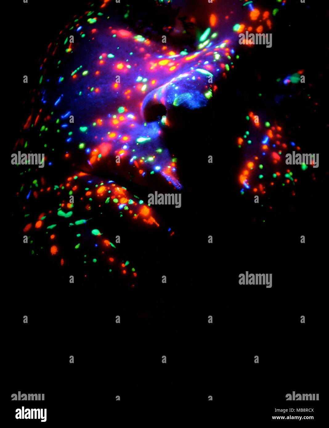 Self Portrait With Abstract UV Paint Stock Photo - Alamy