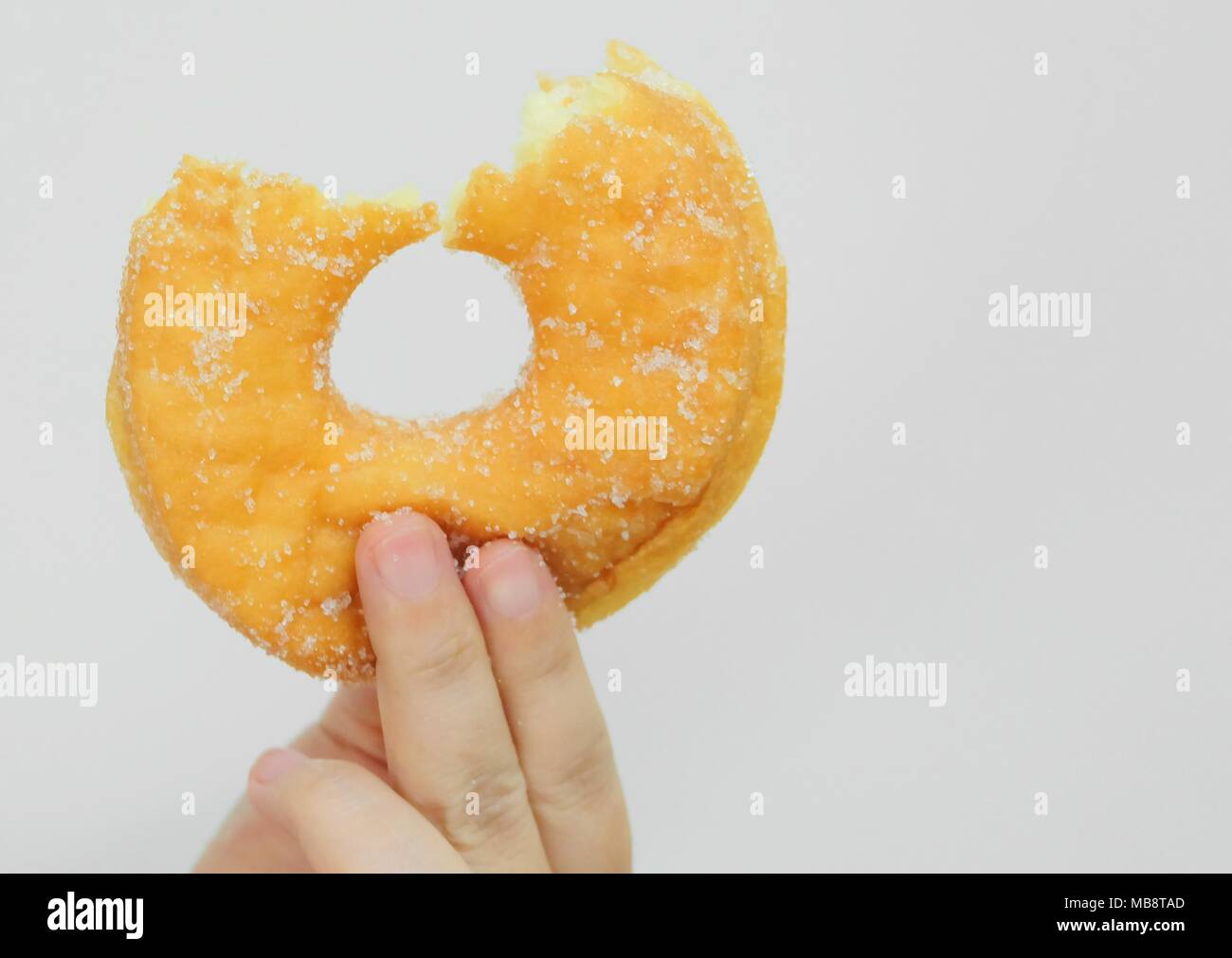 Food and Bakery, Hand Holding Delicious Fresh and Sweet Sugar Donut ...