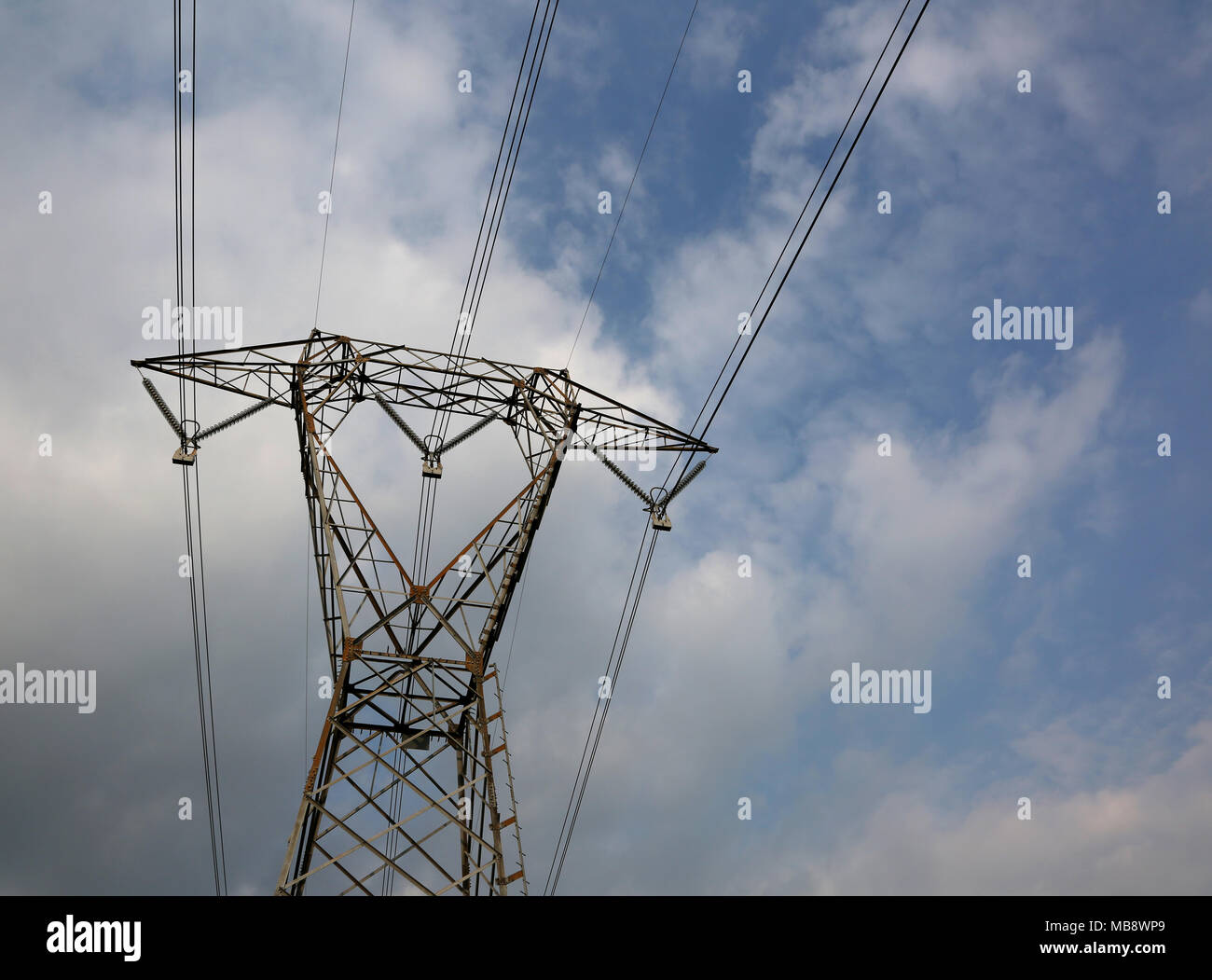 powerline on the high voltage pylon and blue sky Stock Photo - Alamy