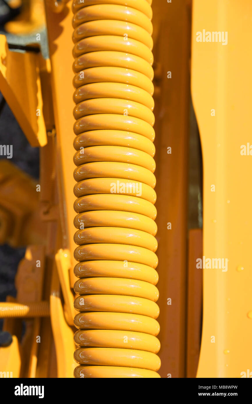 large yellow spring of an industrial heavy transport vehicle Stock ...
