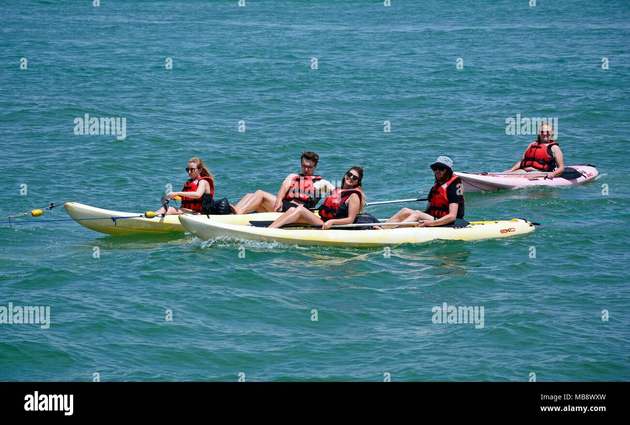 Tourists in canoes on the River Bansafrim, Lagos, Algarve, Portugal ...