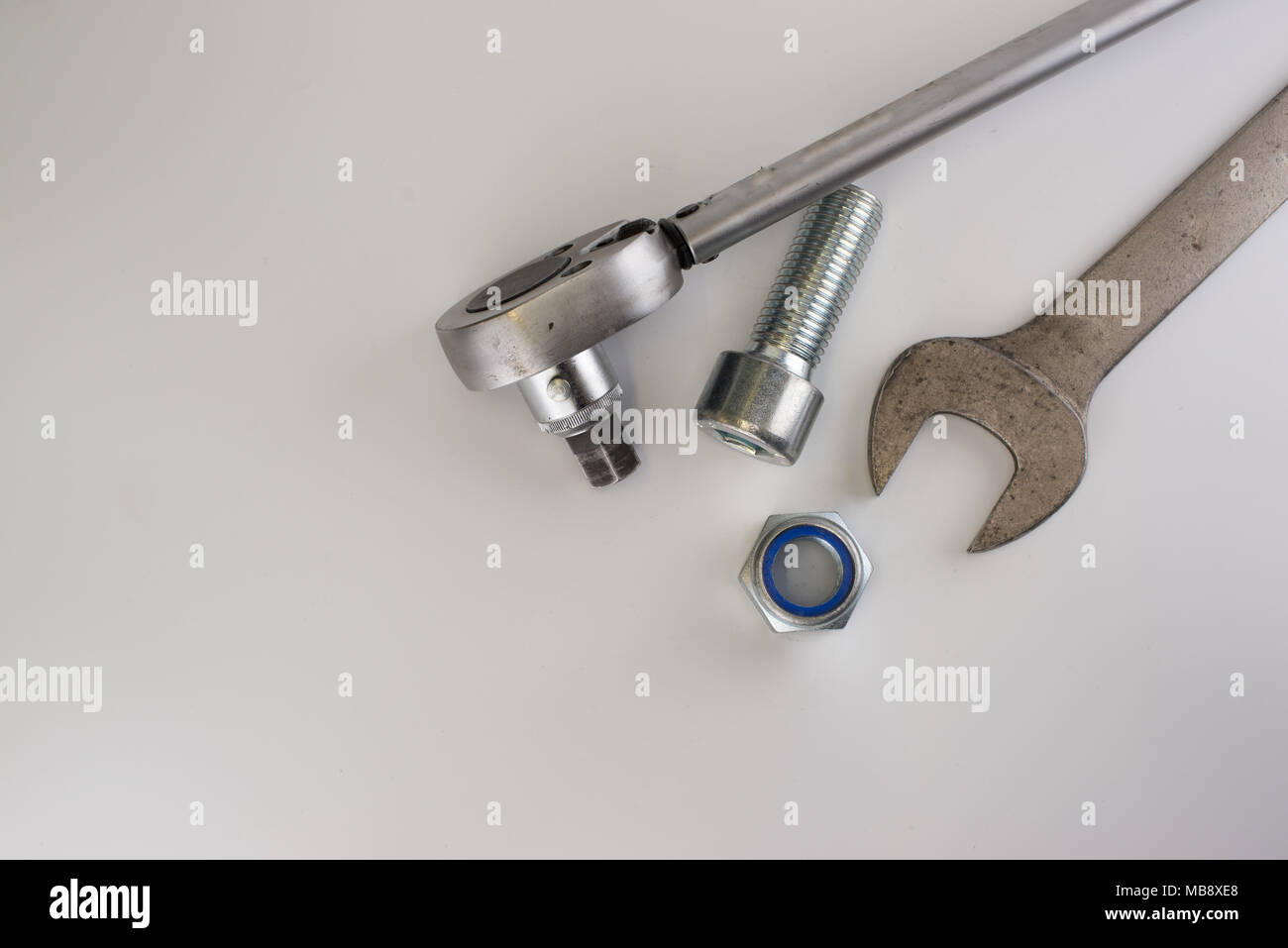 Torque wrench, spanners and nuts on white background Stock Photo - Alamy