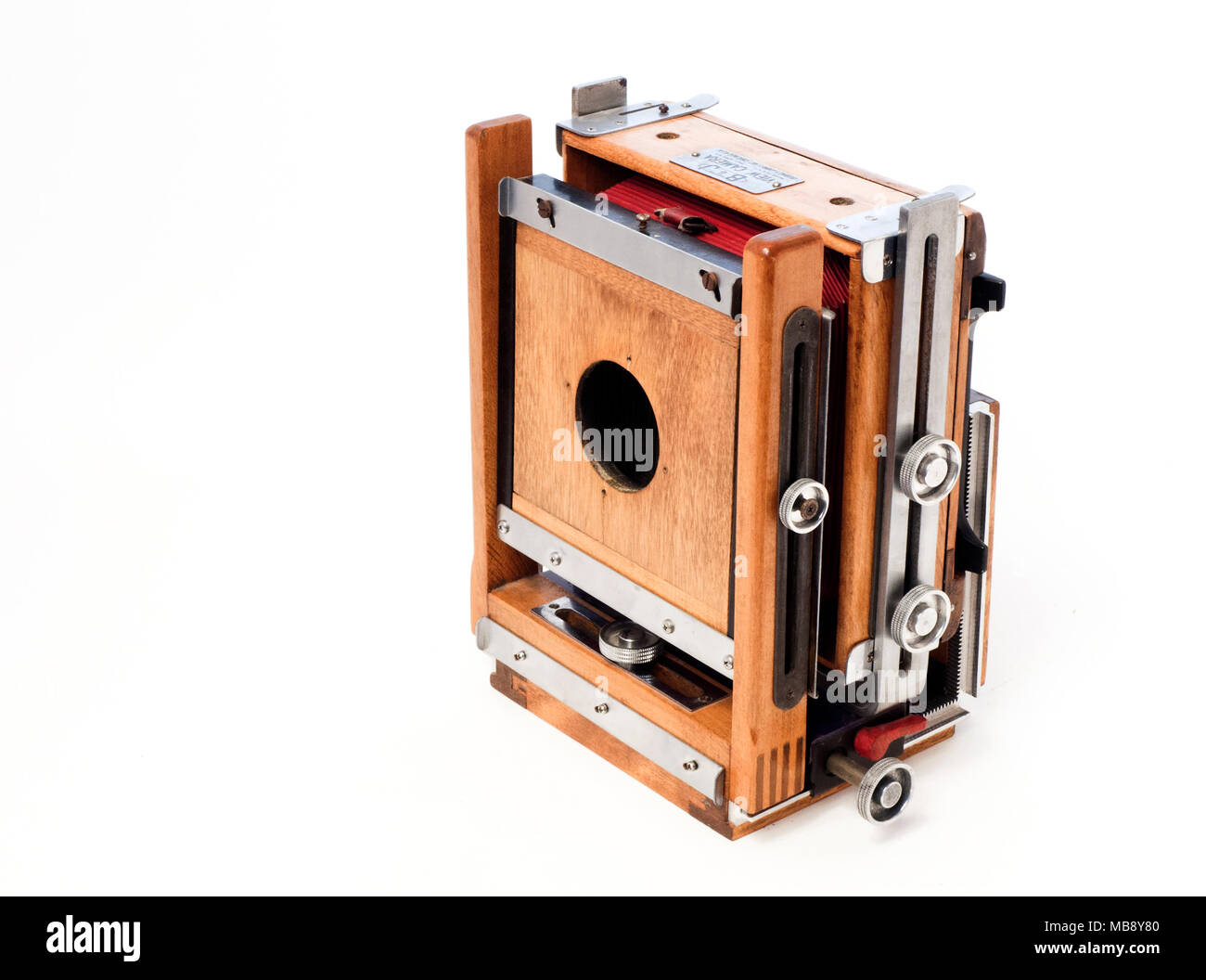 A folded Burke & James 4x5 format flatbed view camera with red bellows ...