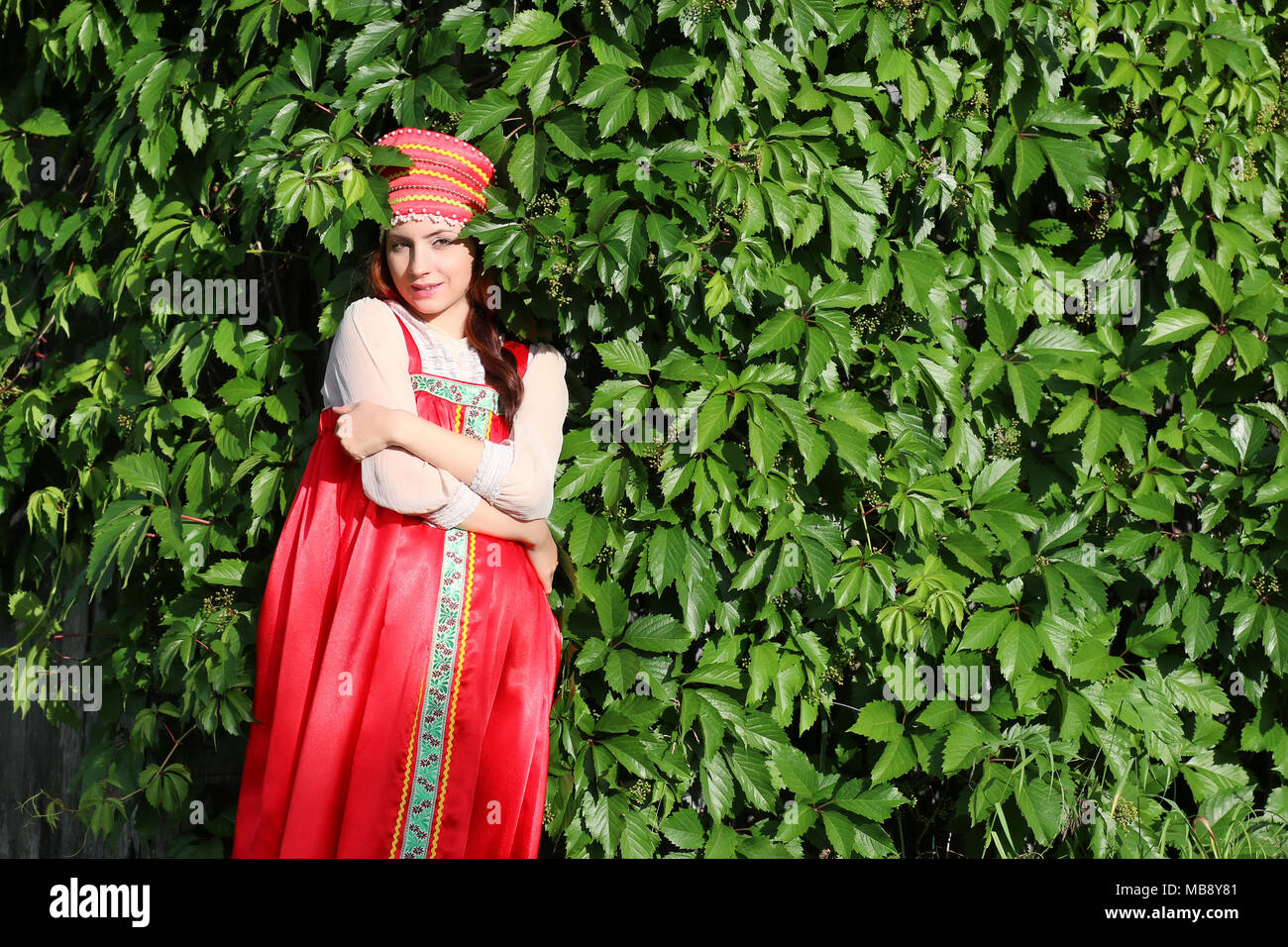 Slav in traditional dress ivy wall tree Stock Photo - Alamy