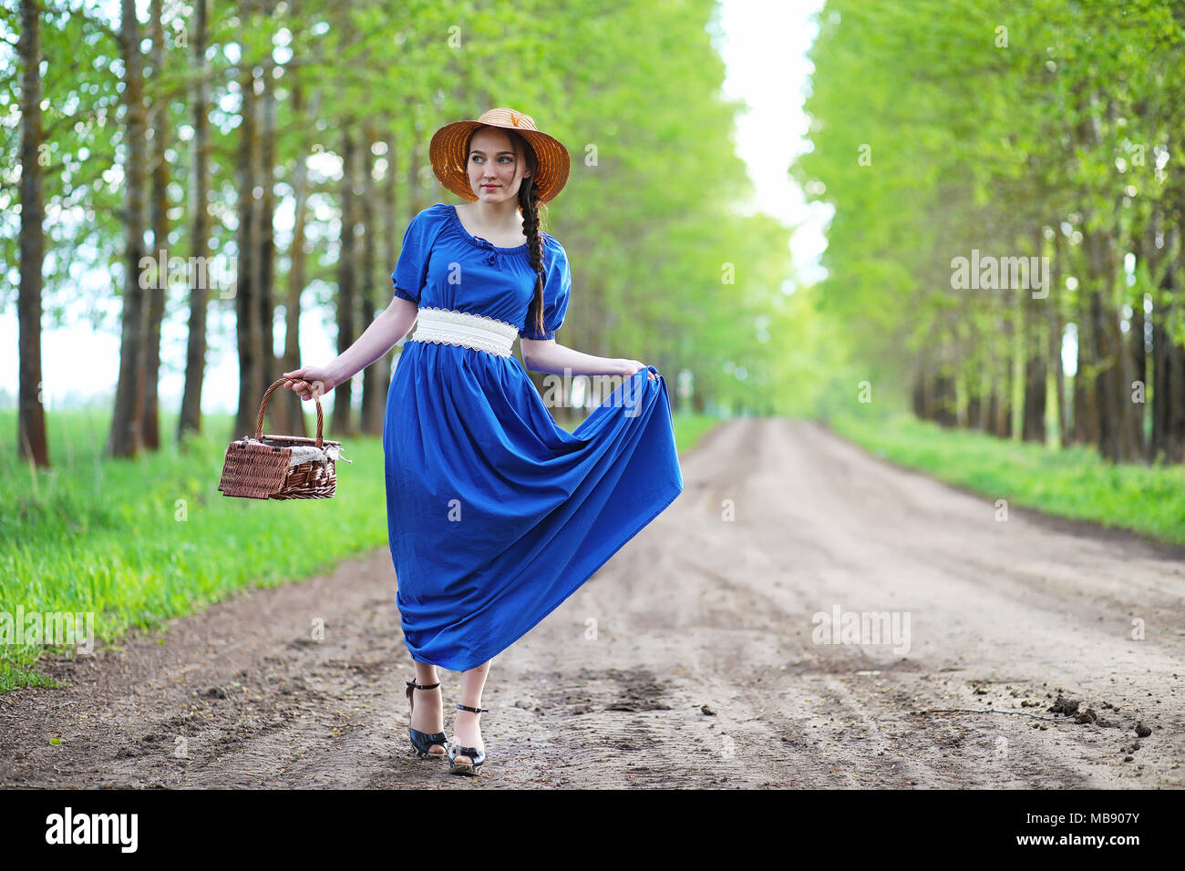 Girl in the countryside in the evening Stock Photo - Alamy