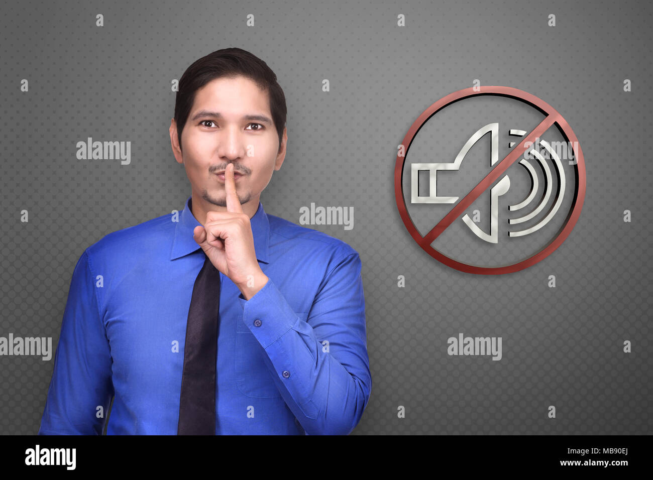 Young asian businessman with silence gesture and asking for quiet on ...