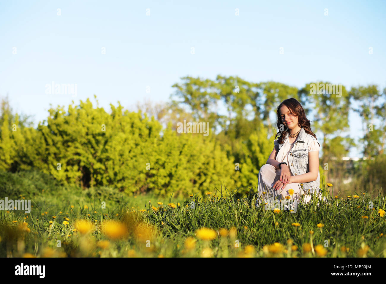 Girl in the park in the spring Stock Photo - Alamy