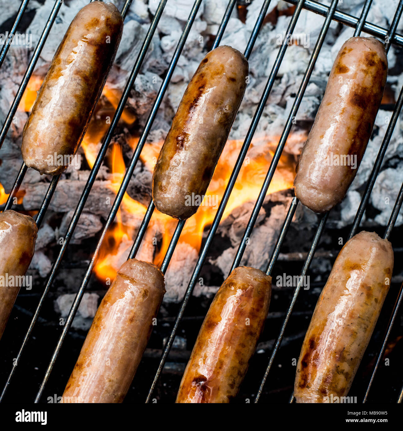 Cooking sausages on bbq hi-res stock photography and images - Alamy