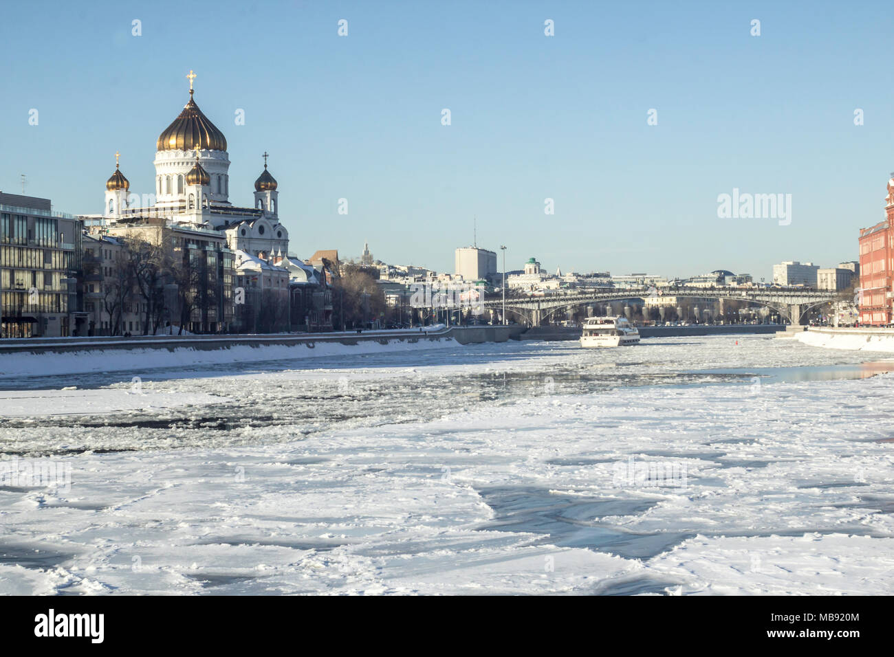 View of Moscow in winter. Ice on the Moscow River. The golden dome of ...