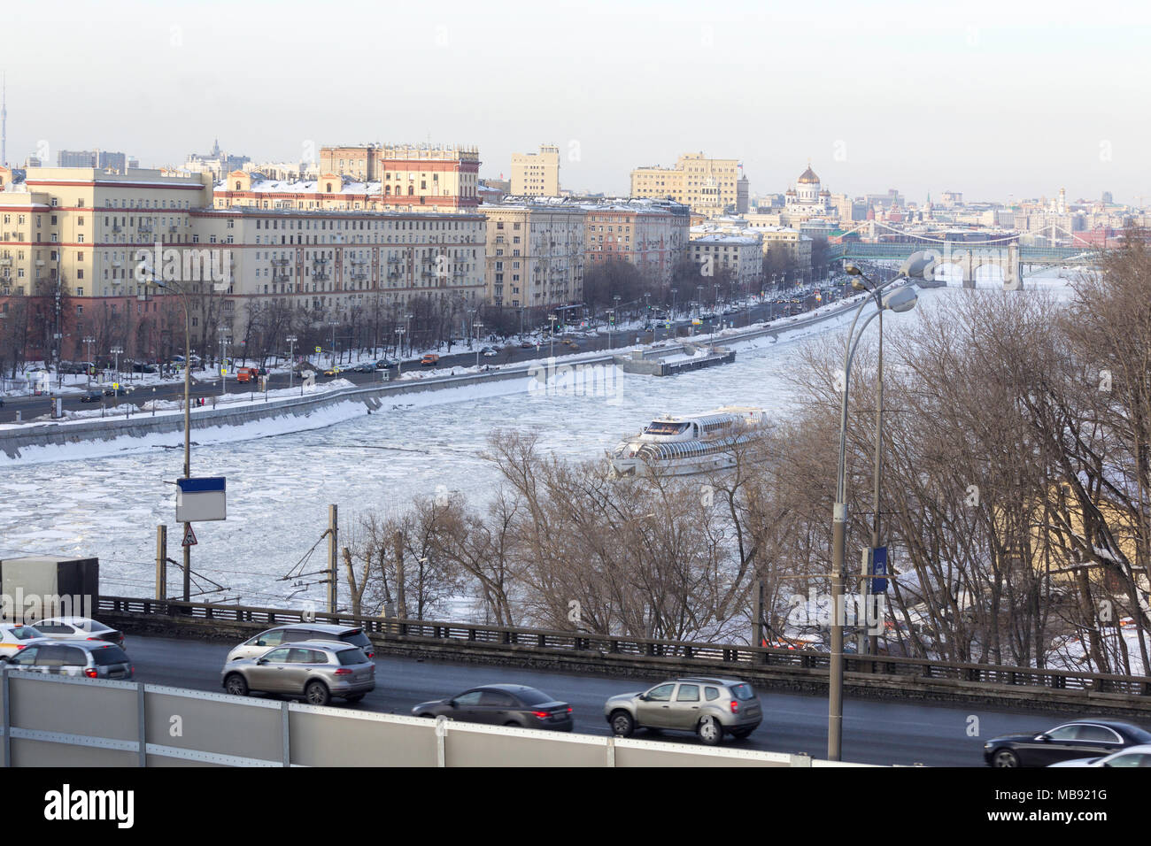 View of Moscow in winter. Ice on the Moscow River. The golden dome of ...