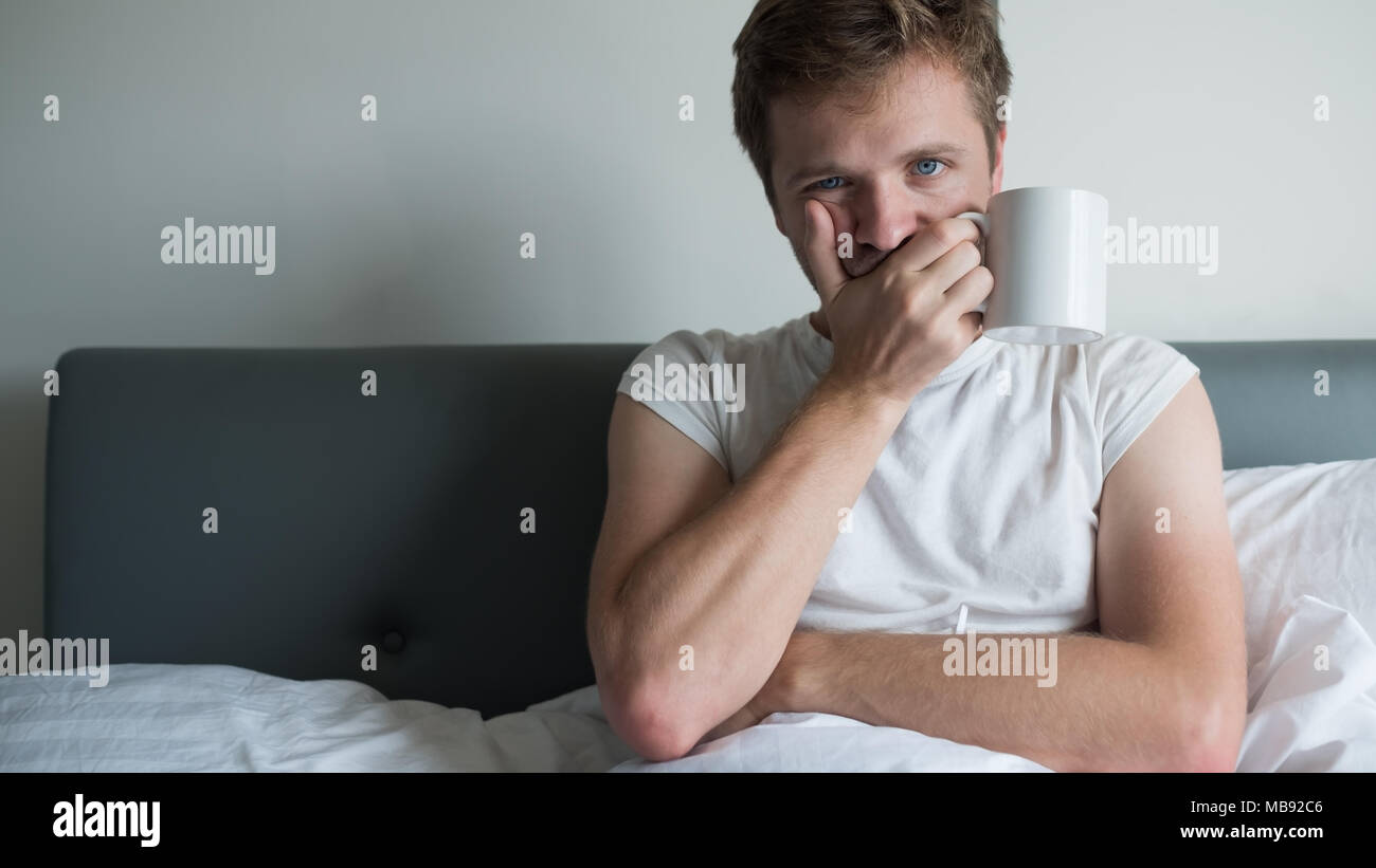 Sad man sitting at home hi-res stock photography and images - Alamy