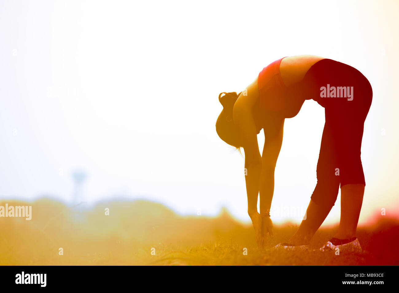 healthy woman stretching hamstring muscle for warm up or cool down ...