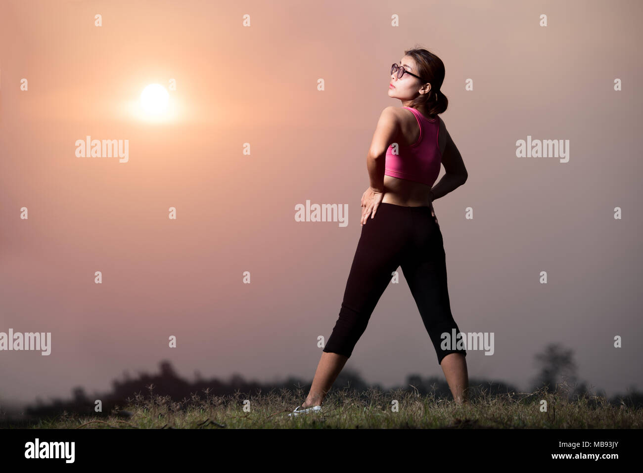 woman exercise with sunset, asian woman stretching muscle before ...