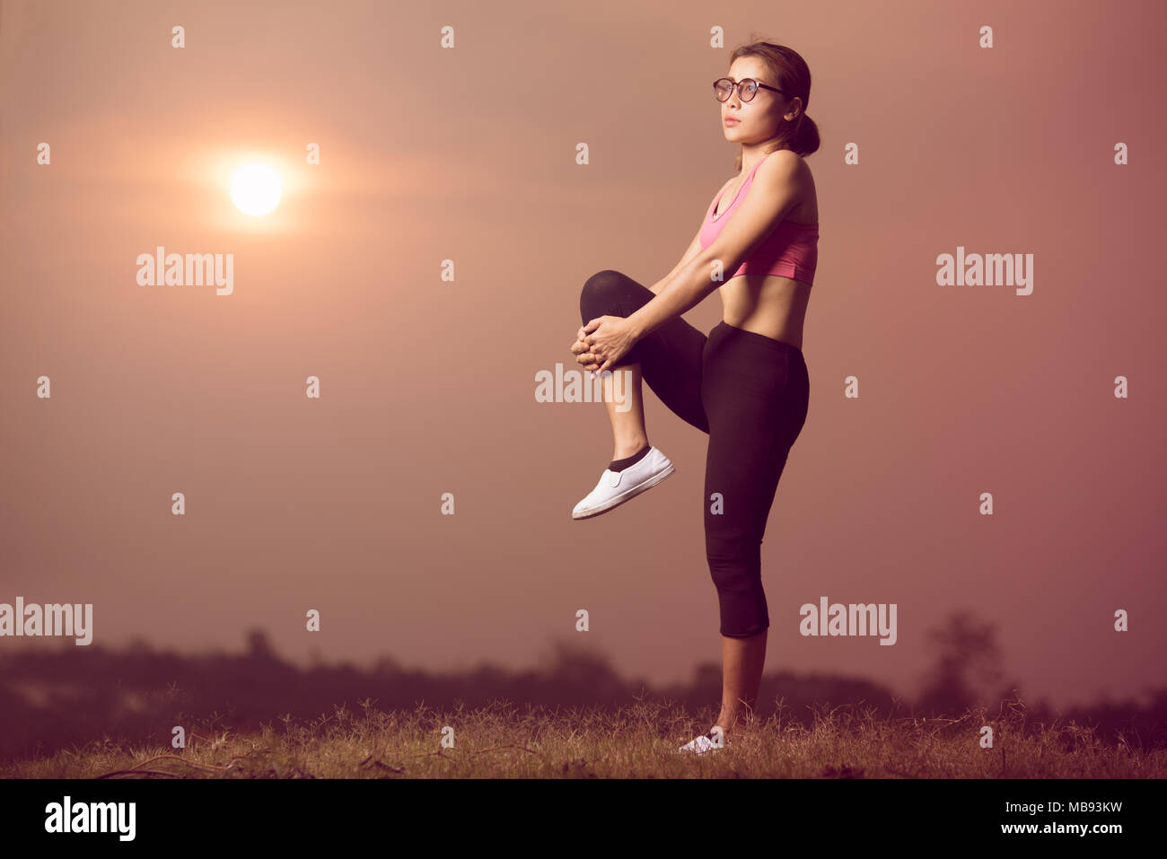 woman exercise with sunset, asian woman stretching muscle before ...