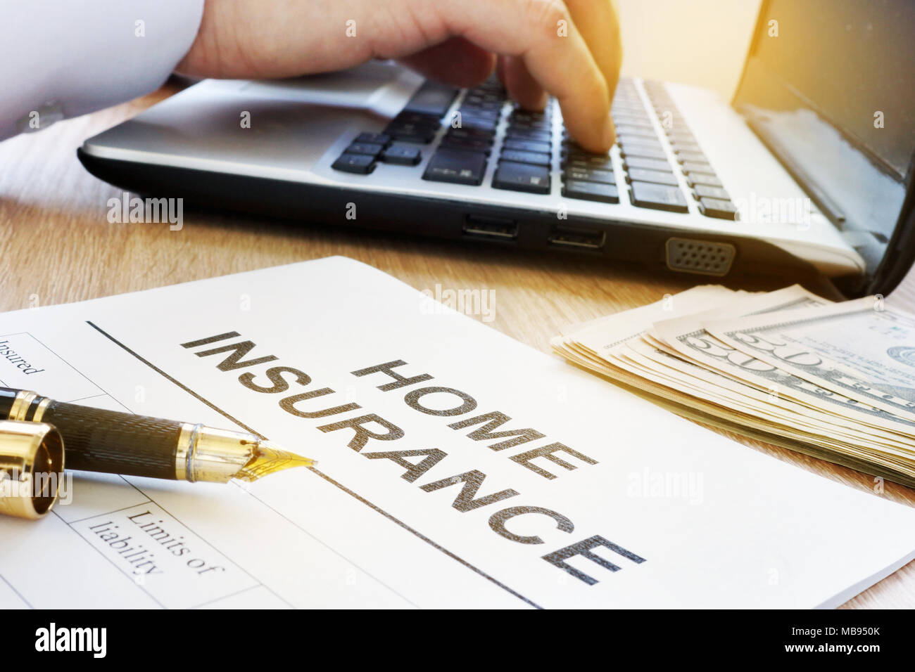 Home insurance form on a table in an agency Stock Photo - Alamy