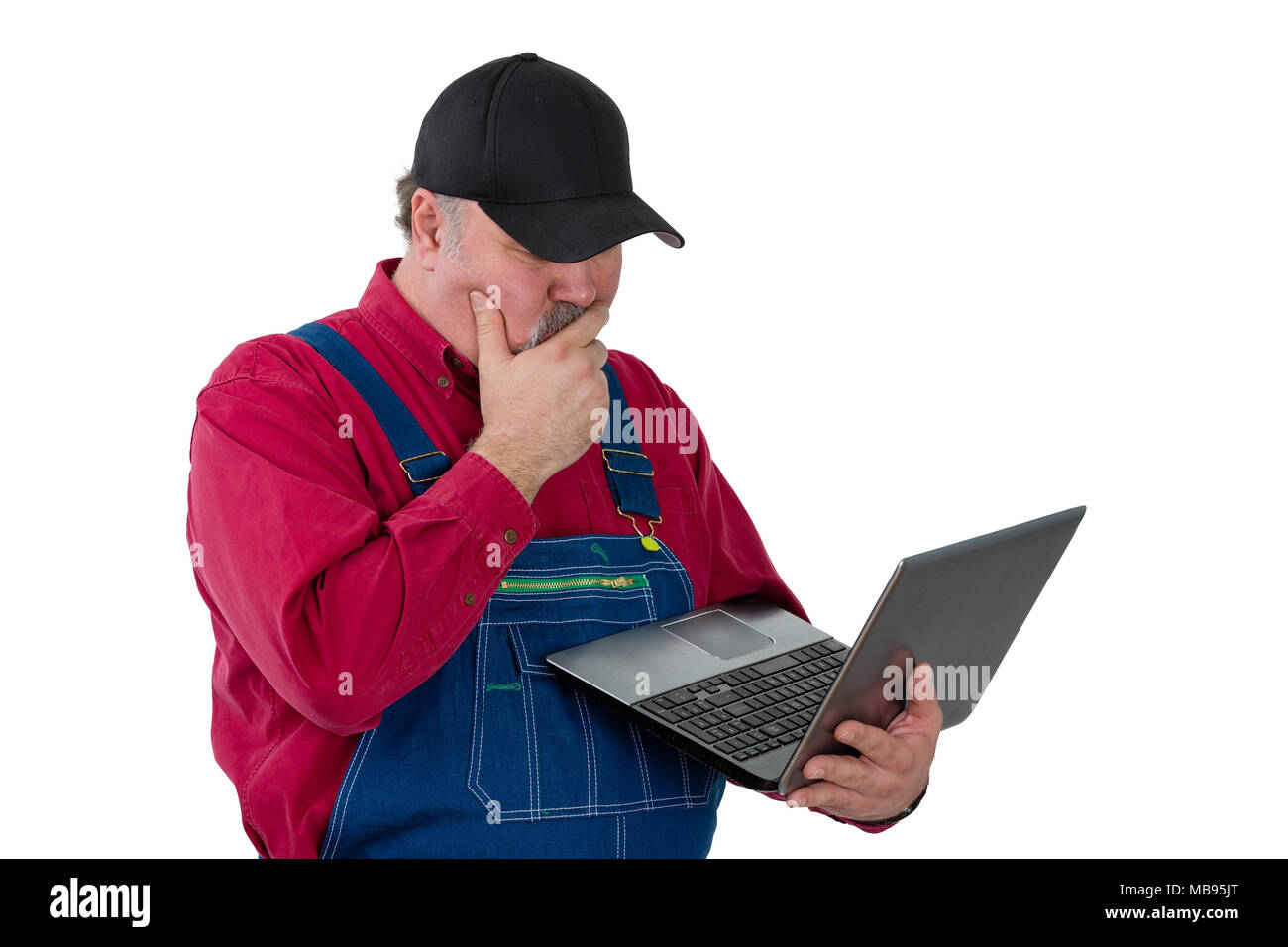 Confused middle-class worker standing thinking as he peers at a ...