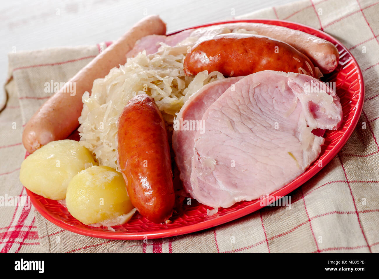 a plate of sauerkraut garnished Alsacien Stock Photo - Alamy